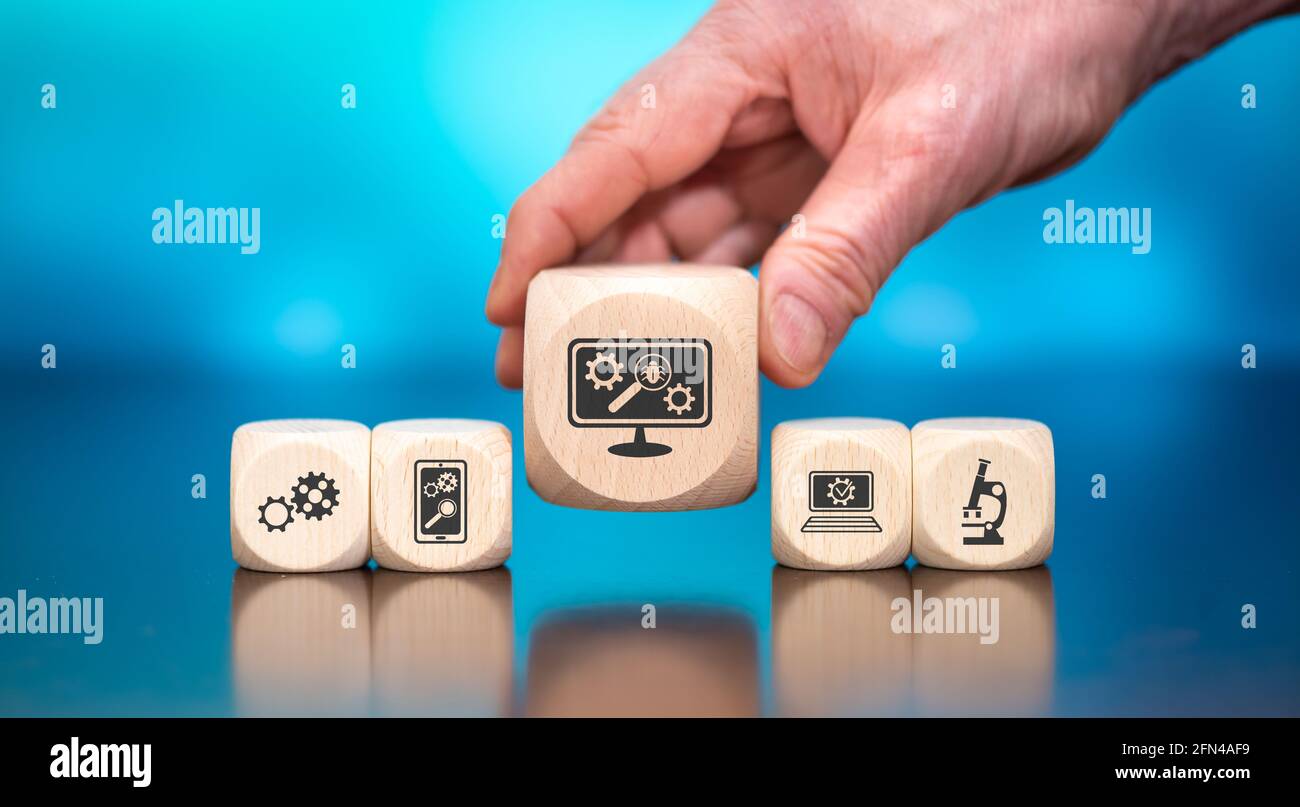 Wooden blocks with symbol of software testing concept on blue ...