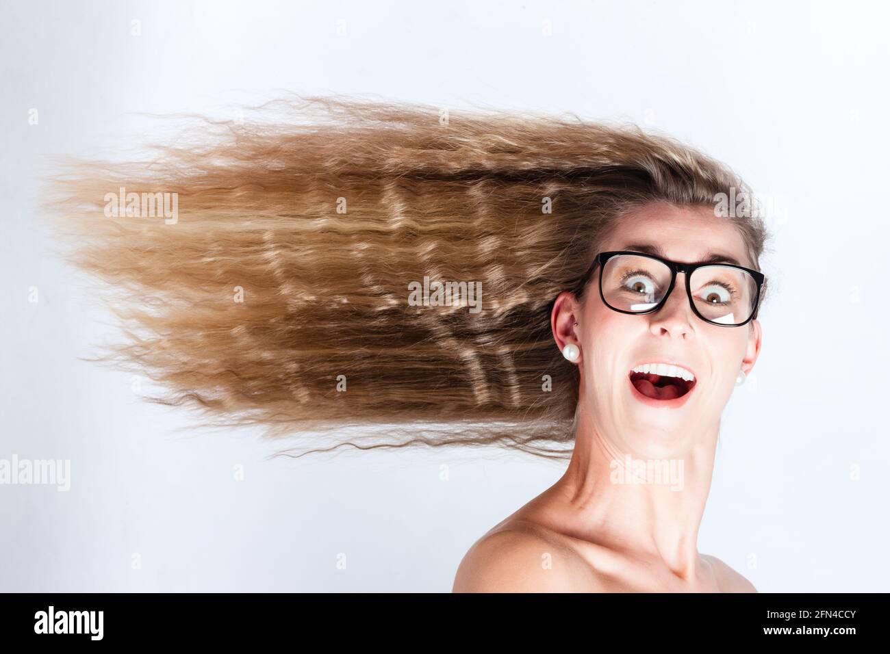 Long hair of woman blowing in head wind Stock Photo - Alamy