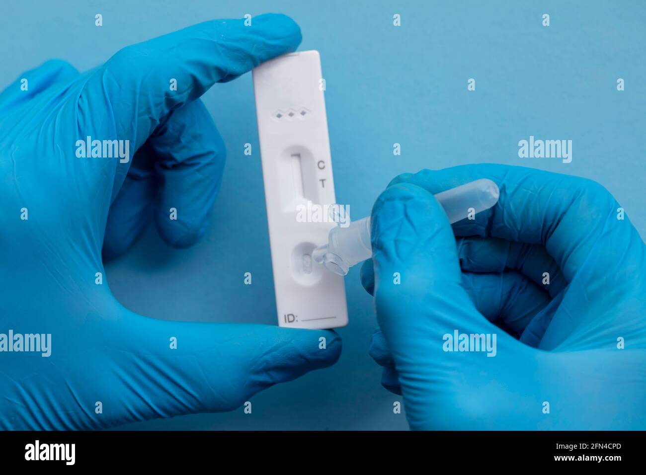 Close up of a person using coronavirus covid-19 rapid antigen home ...