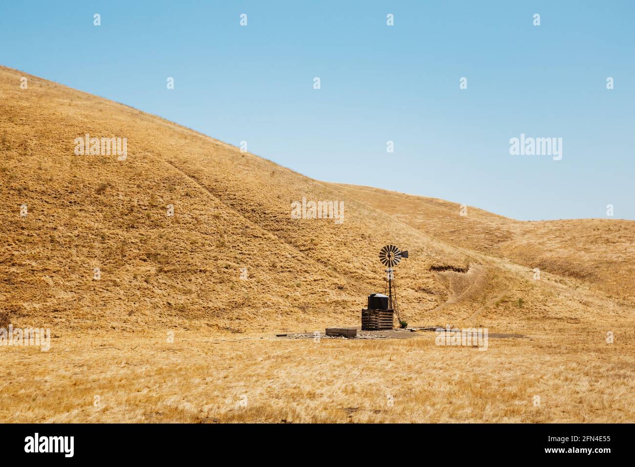 Diablo Range in California, USA with a metal pole in a dry field next ...