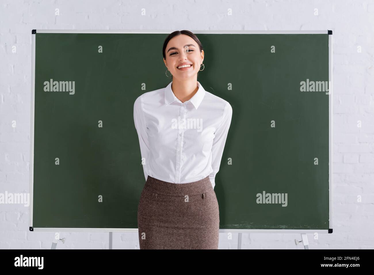 Smiling teacher looking beautiful hi-res stock photography and images ...