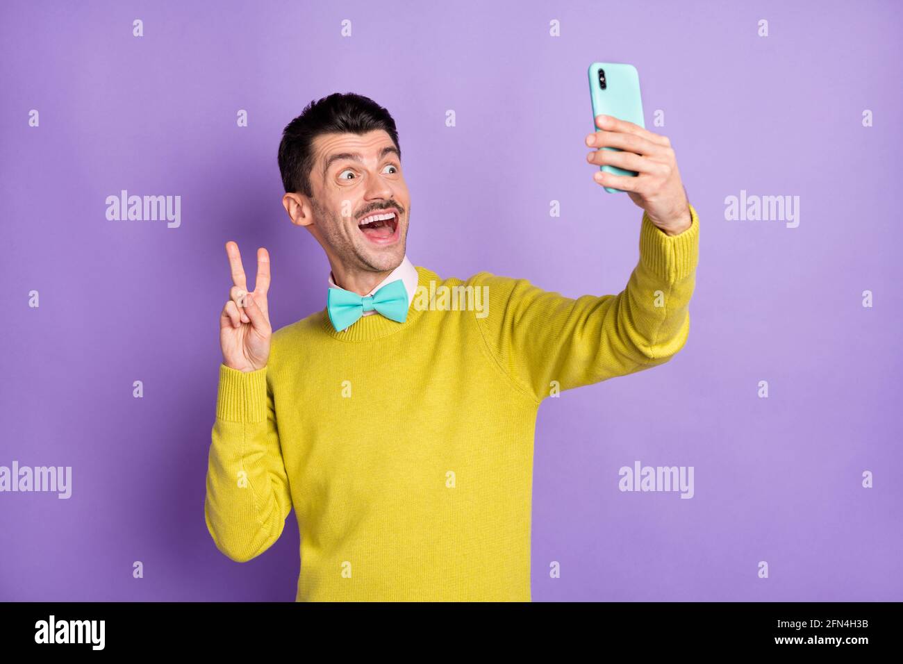 Portrait of brunet optimistic guy do selfie telephone show v-sign wear ...