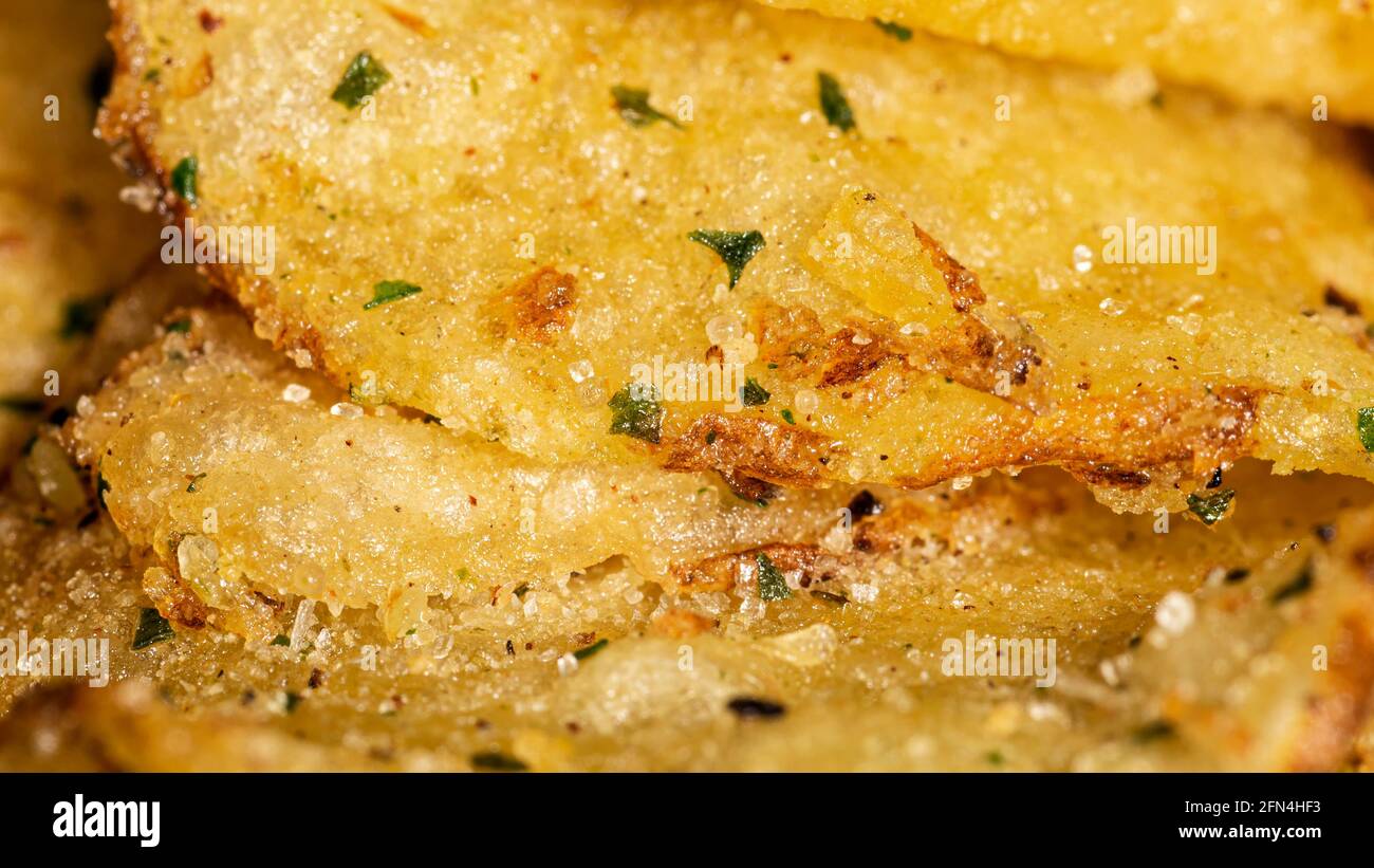 Natural fat potato chips with salt, black pepper, herbs and vegetable ...