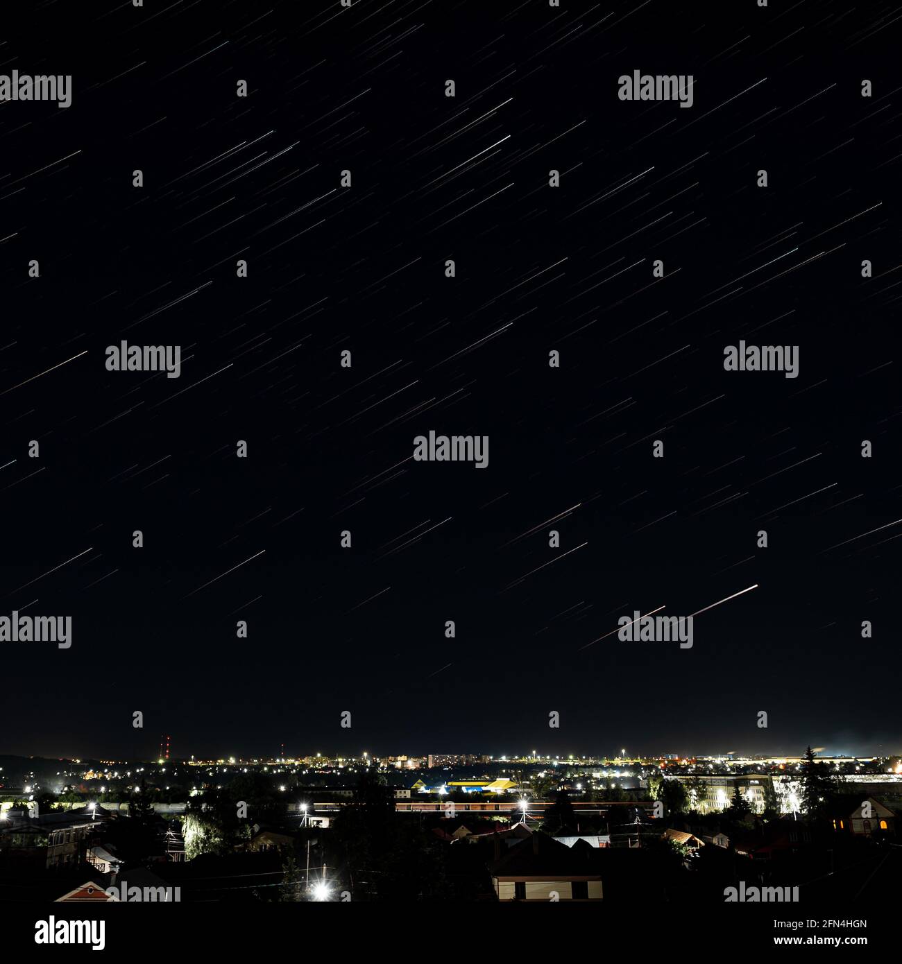 Star trails, movement of stars over a provincial Russian town Stock ...