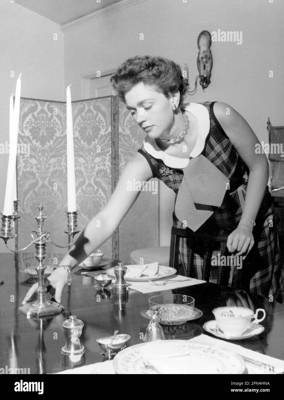 household, laying the table, woman arranging the table for dinner, USA ...