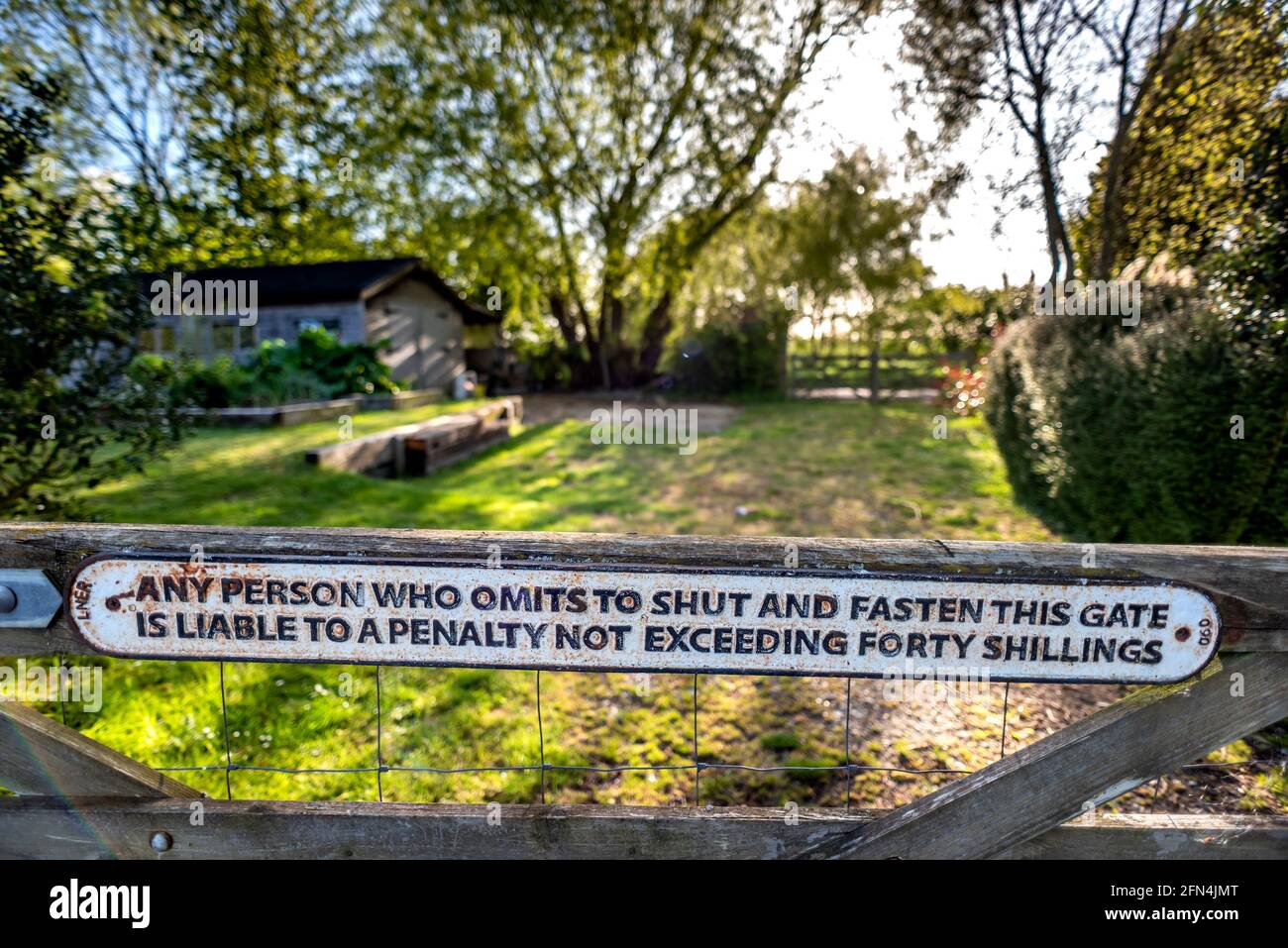 Cooling, May 10th 2021: Signage on a garden gate in Cooling, on the Hoo ...