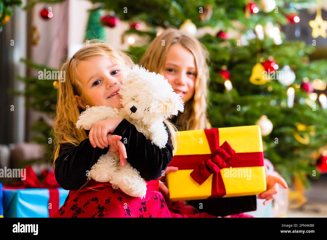Children receiving presents on Christmas day Stock Photo - Alamy