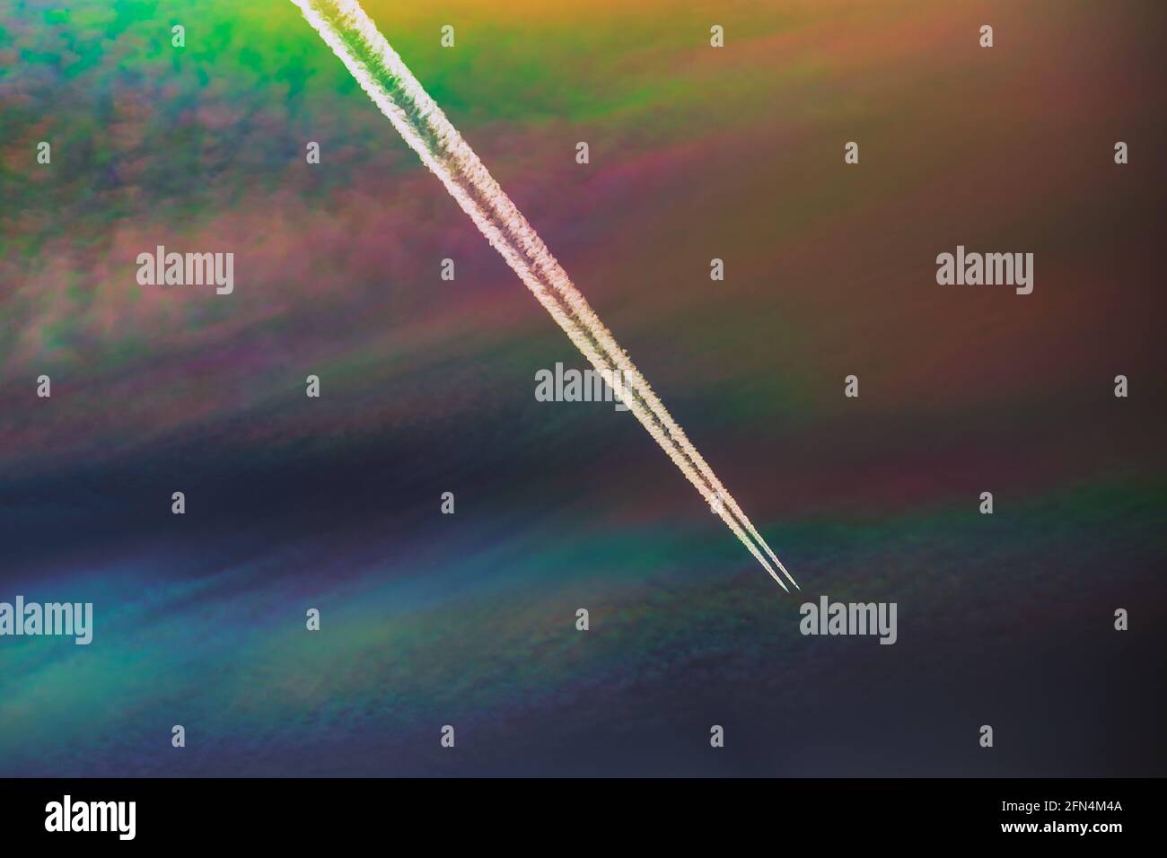 A rare sight: iridescent clouds with a plane. Diffraction can make ...