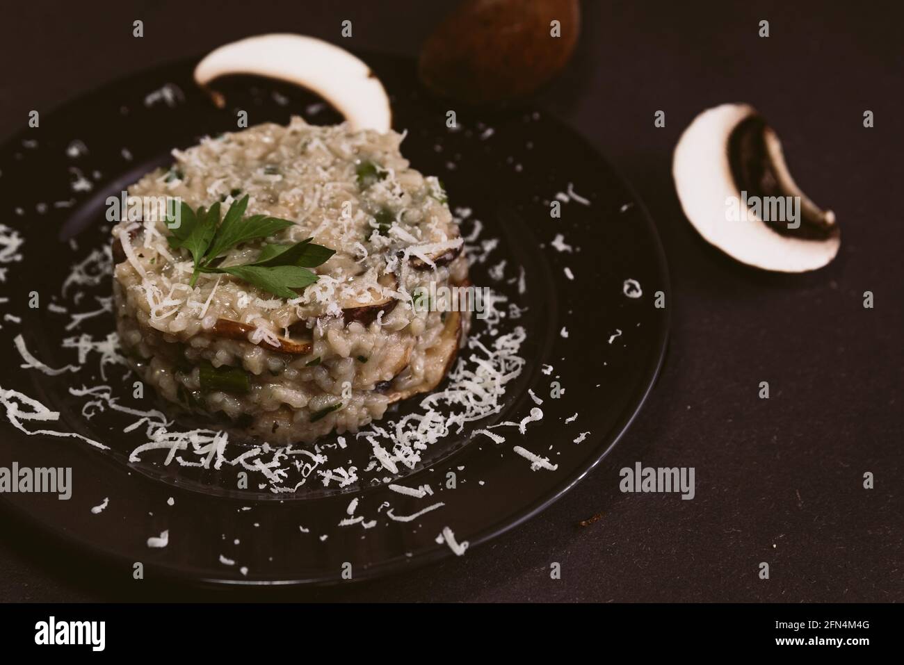 simple italian vegan mushroom risotto on dark background with real ...