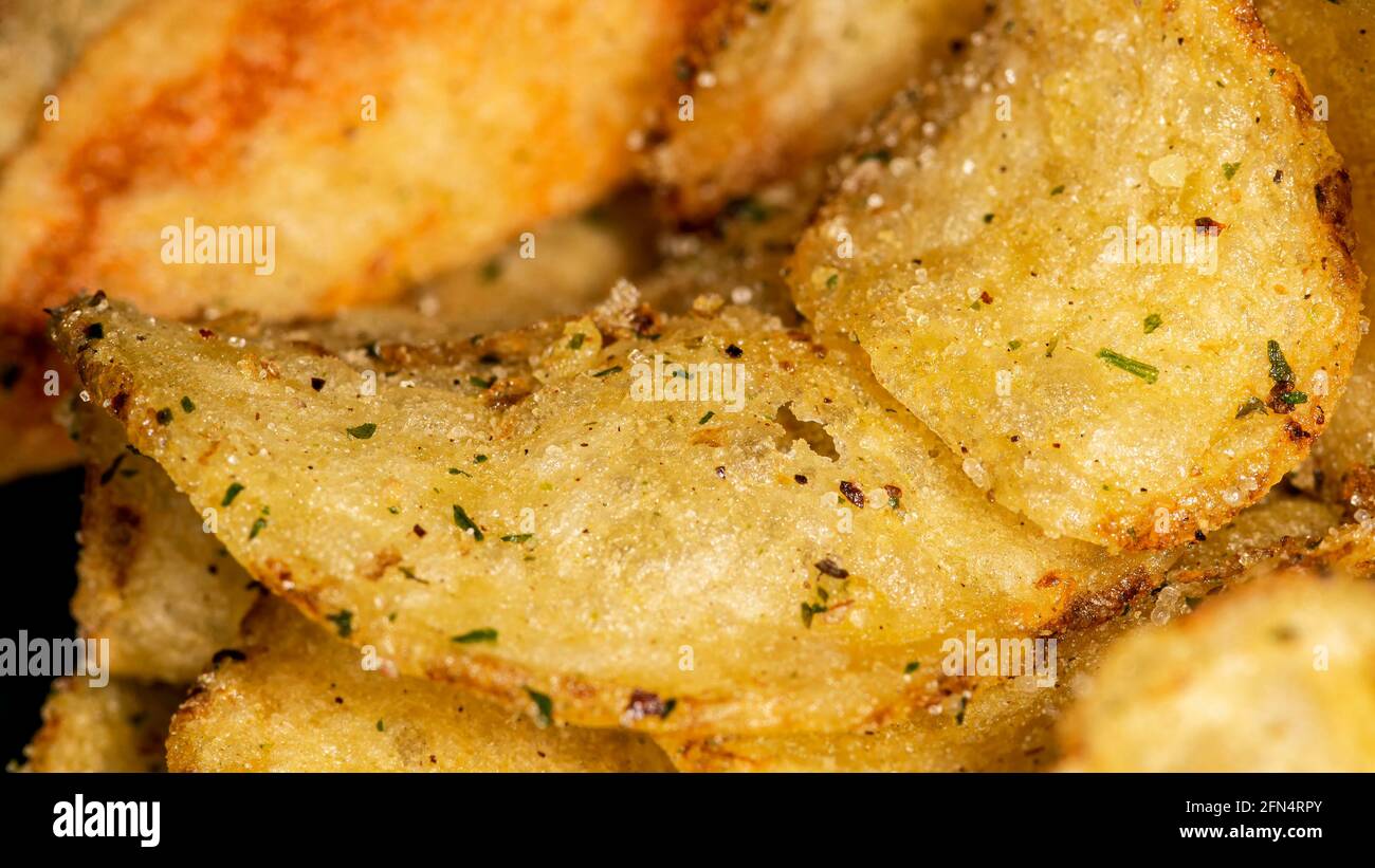 Natural fat potato chips with salt, black pepper, herbs and vegetable ...