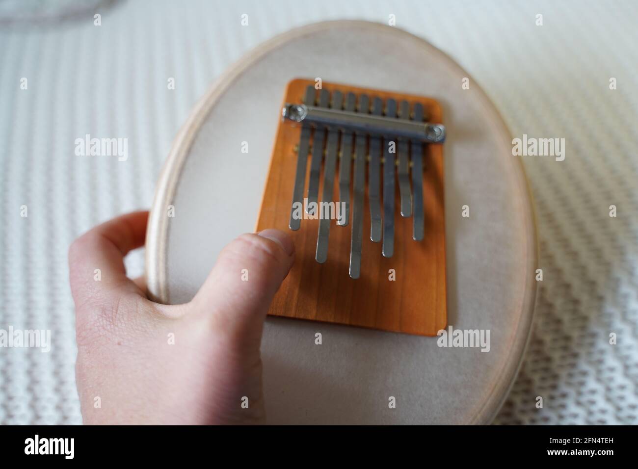 Sansula, sound healing instrument in a female hand in a sound healing ...