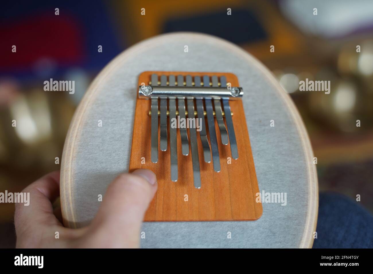 Sansula, sound healing instrument in a female hand in a sound healing ...
