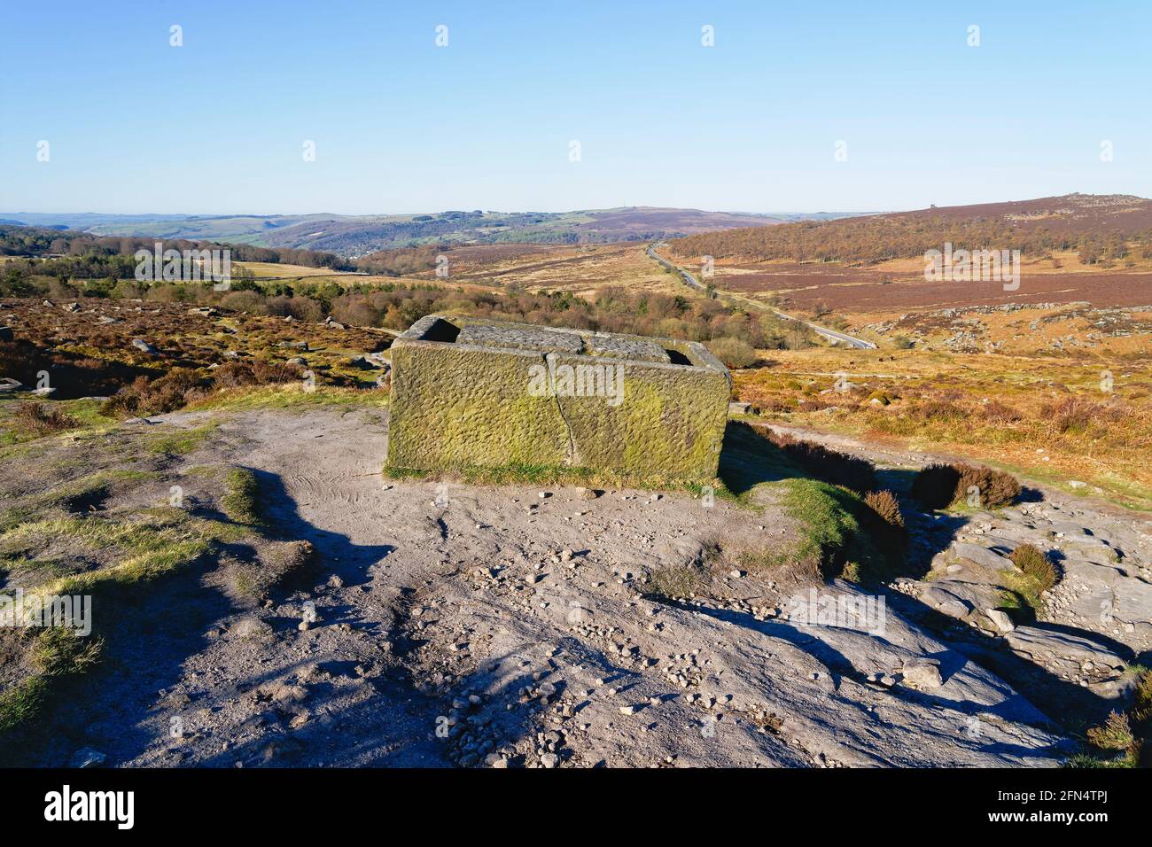 Large cracked, old unfinished stone trough sitting on Burbage Edge ...