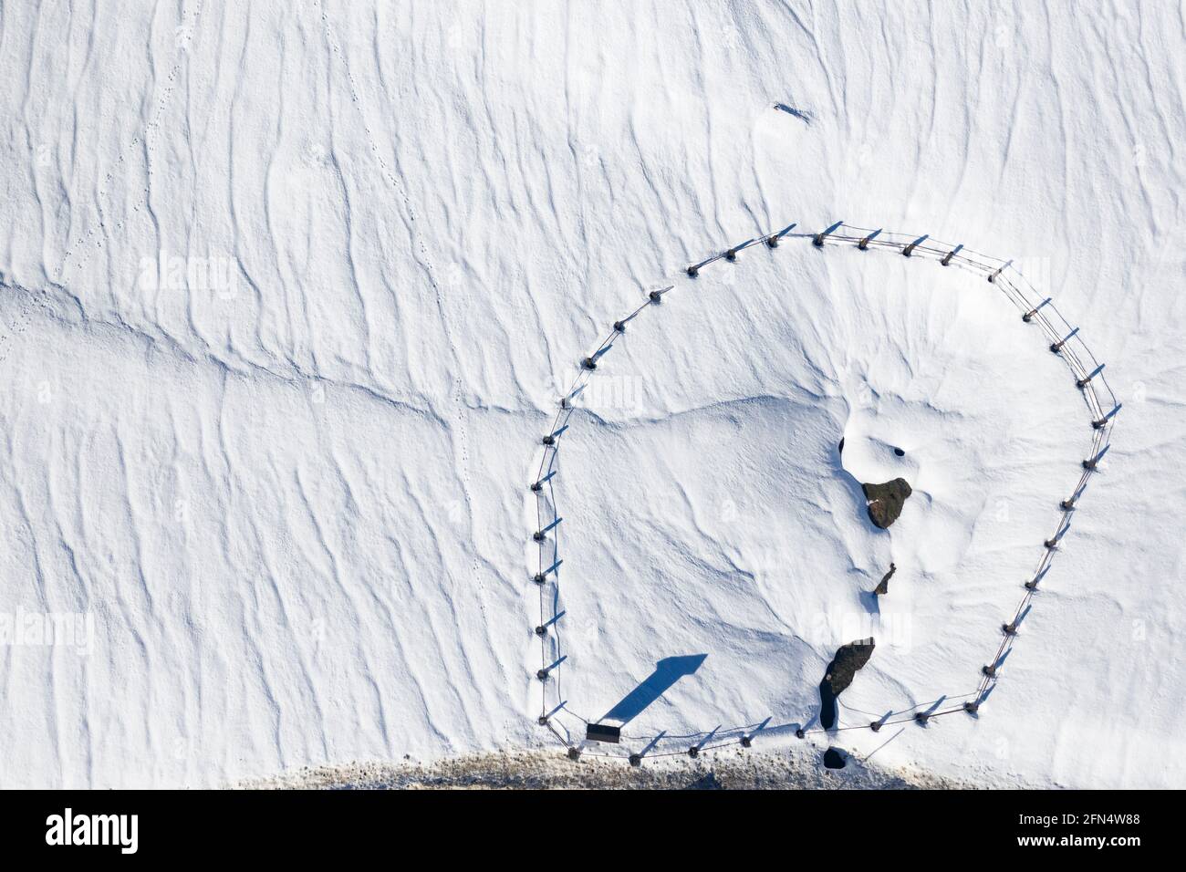 Aerial view of the Pla de Beret meadows in winter. Source of the river ...