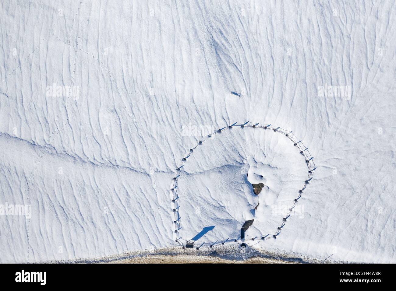 Aerial view of the Pla de Beret meadows in winter. Source of the river ...