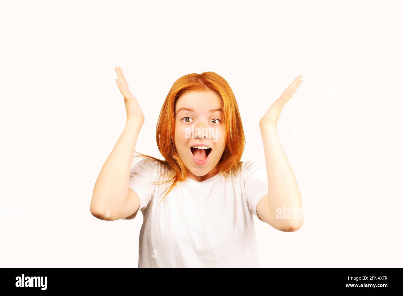 Beautiful redheaded happy young woman, rejoice w/ funny facial ...