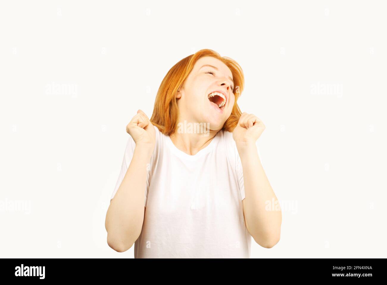 Beautiful redheaded happy young woman, rejoice w/ funny facial ...