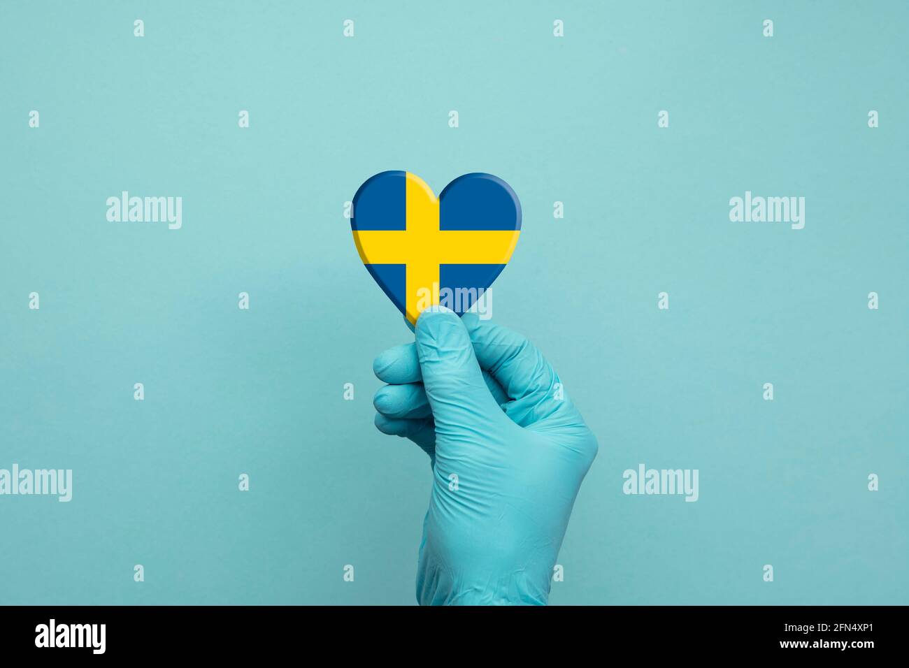 Hands holding swedish flag hi-res stock photography and images - Alamy