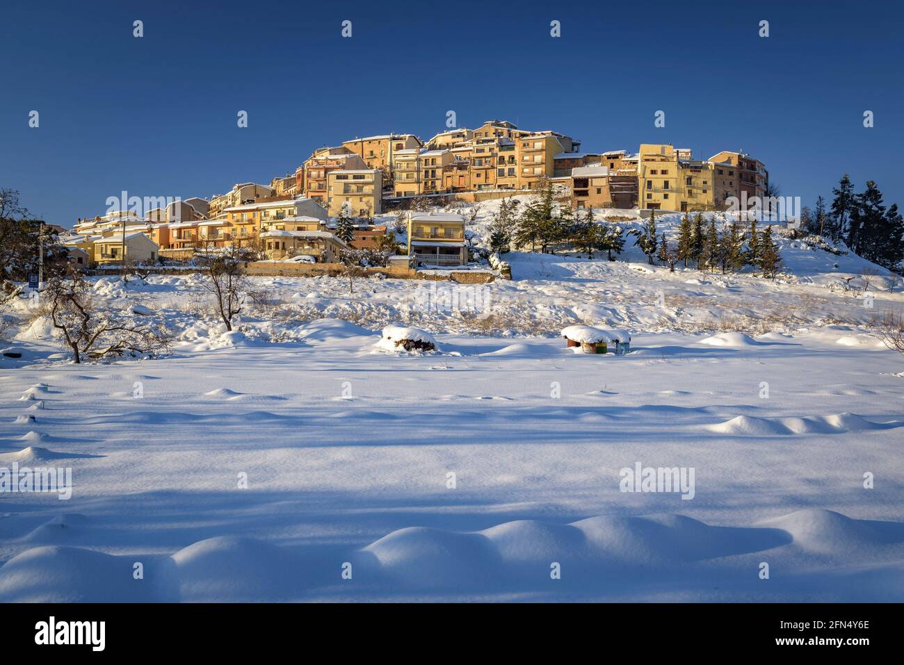 Horta de Sant Joan village in a winter snowy sunset after a heavy ...