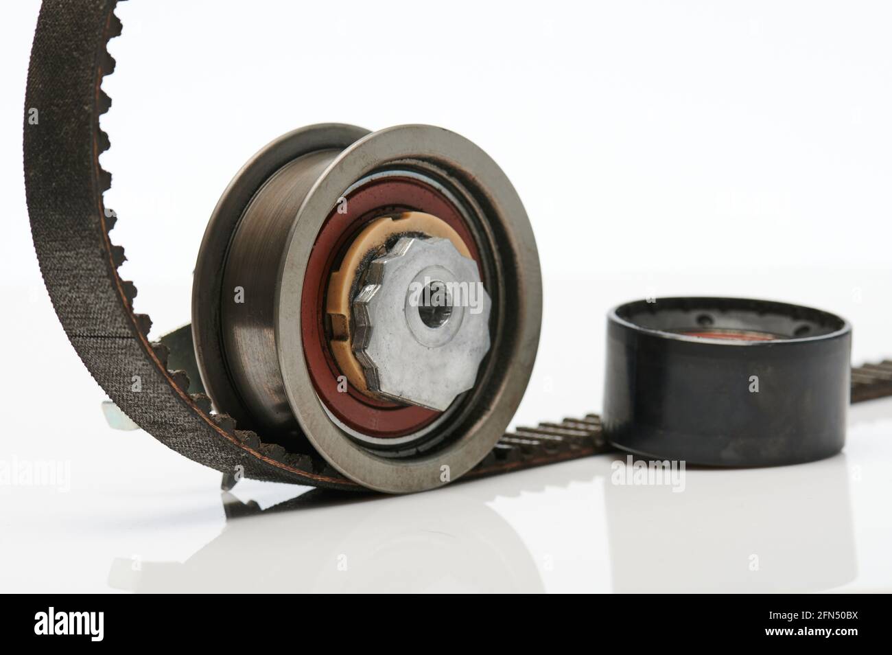 Timing belt and roller for car service isolated on white studio ...