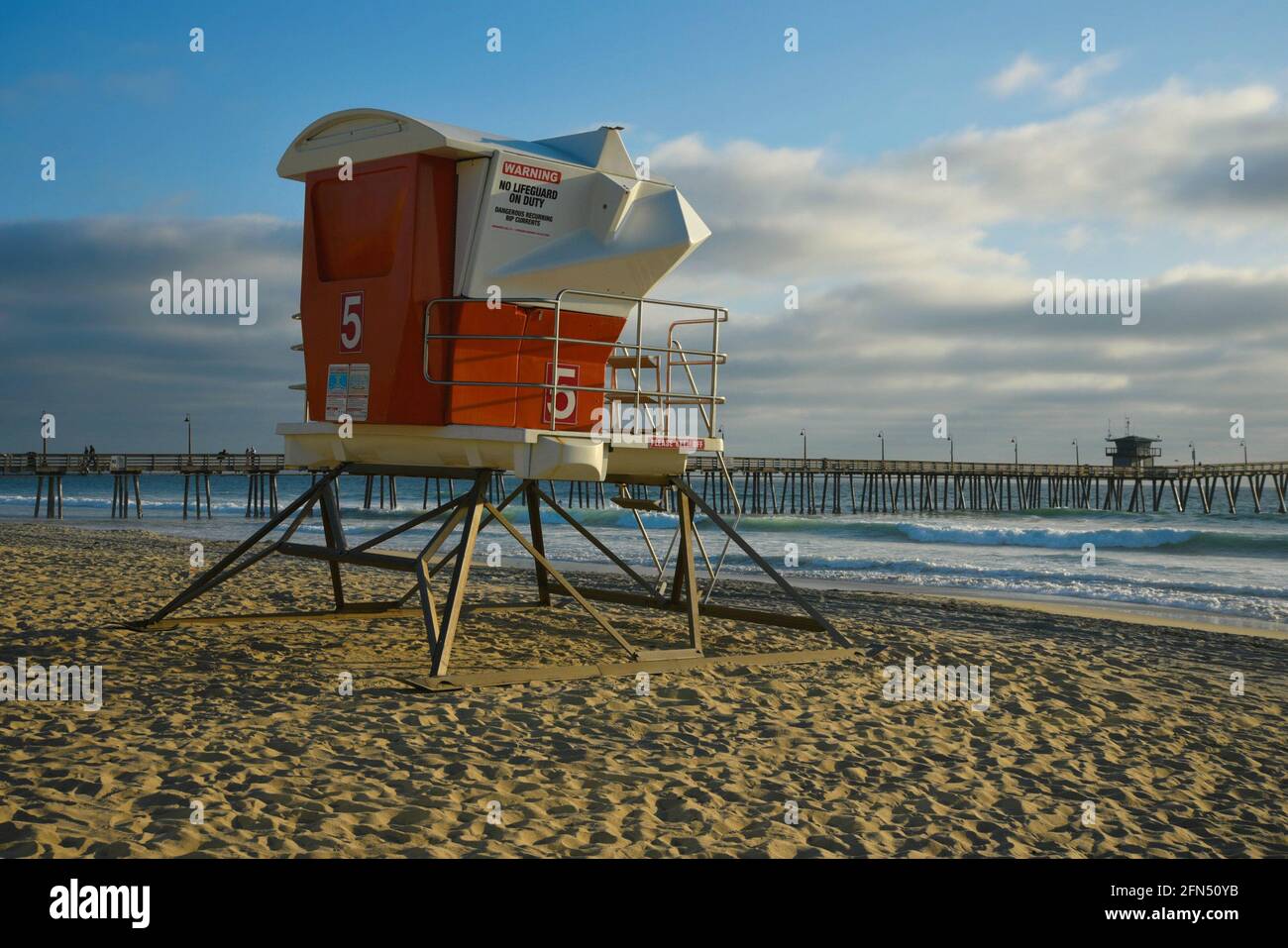 Seascape with panoramic view of a lifeguard watchtower on the sandy ...