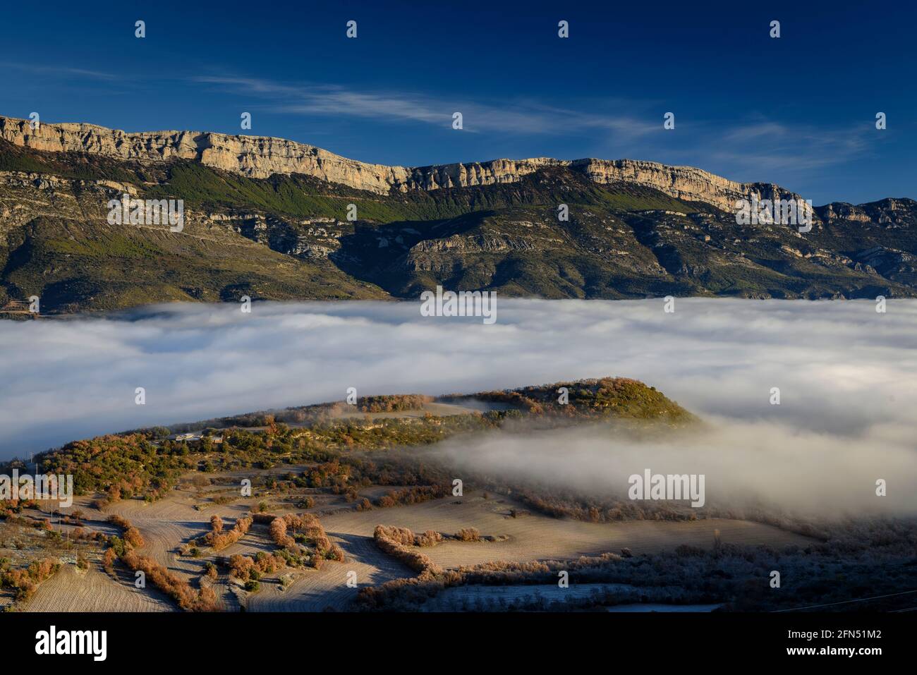 Winter sunrise with fog over Montsec range, seen from Port d'Àger ...