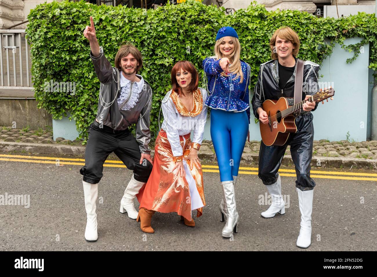 London, UK. 14 May 2021. The cast of ABBA MANIA at a photocall outside ...