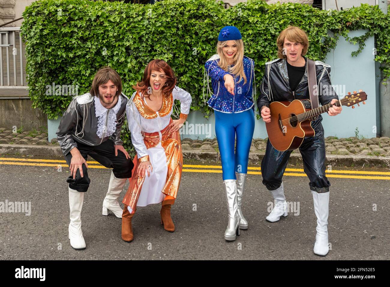 London, UK. 14 May 2021. The cast of ABBA MANIA at a photocall outside ...