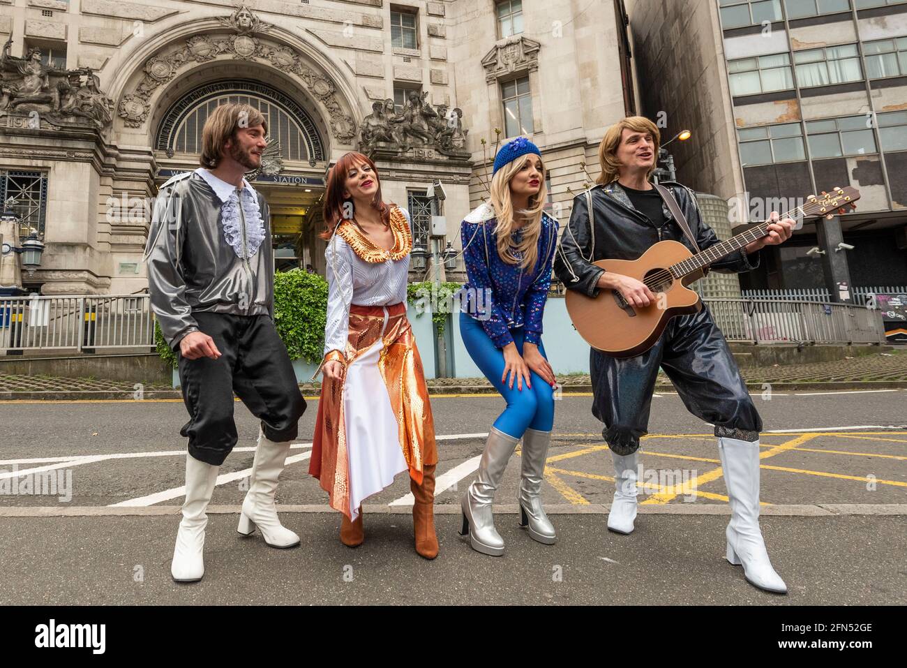London, UK. 14 May 2021. The cast of ABBA MANIA at a photocall outside ...