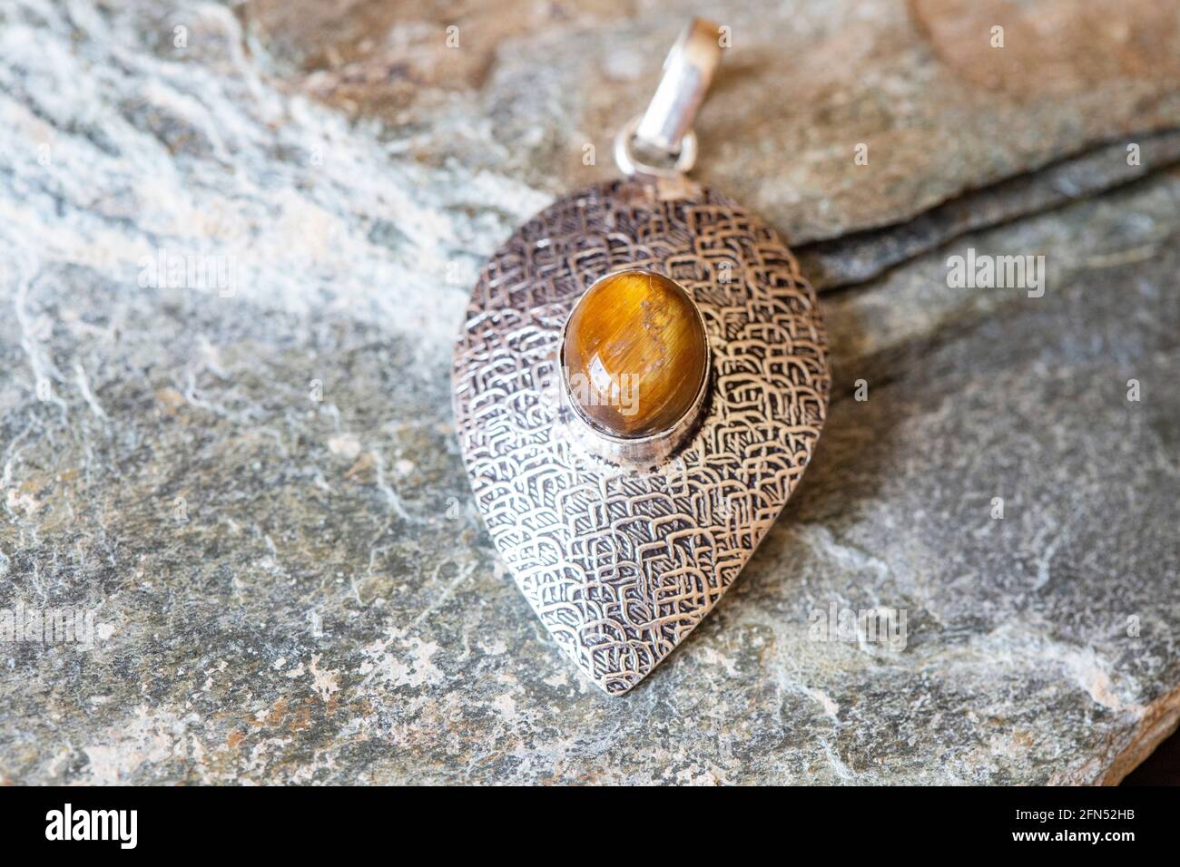 Silver metal pendant in natural shape with mineral stone decoration ...