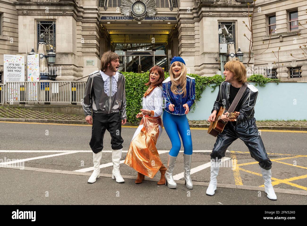 London, UK. 14 May 2021. The cast of ABBA MANIA at a photocall outside ...
