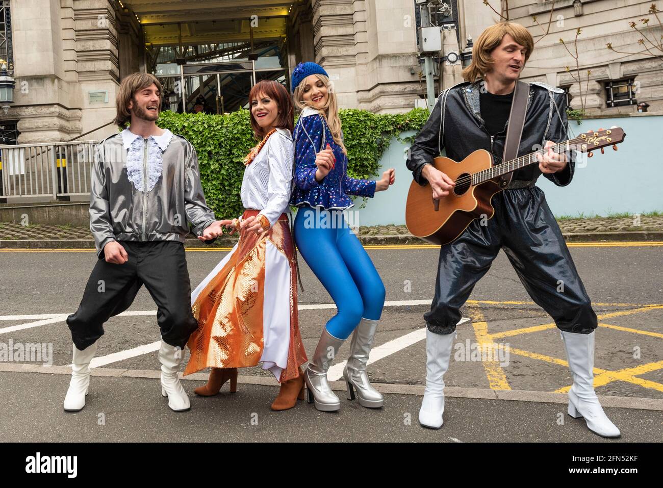 London, UK. 14 May 2021. The cast of ABBA MANIA at a photocall outside ...