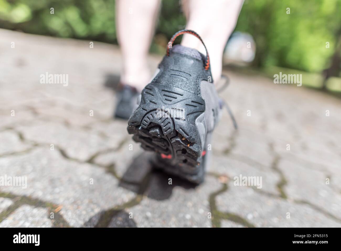 Back view of jogger running outdoors Stock Photo - Alamy