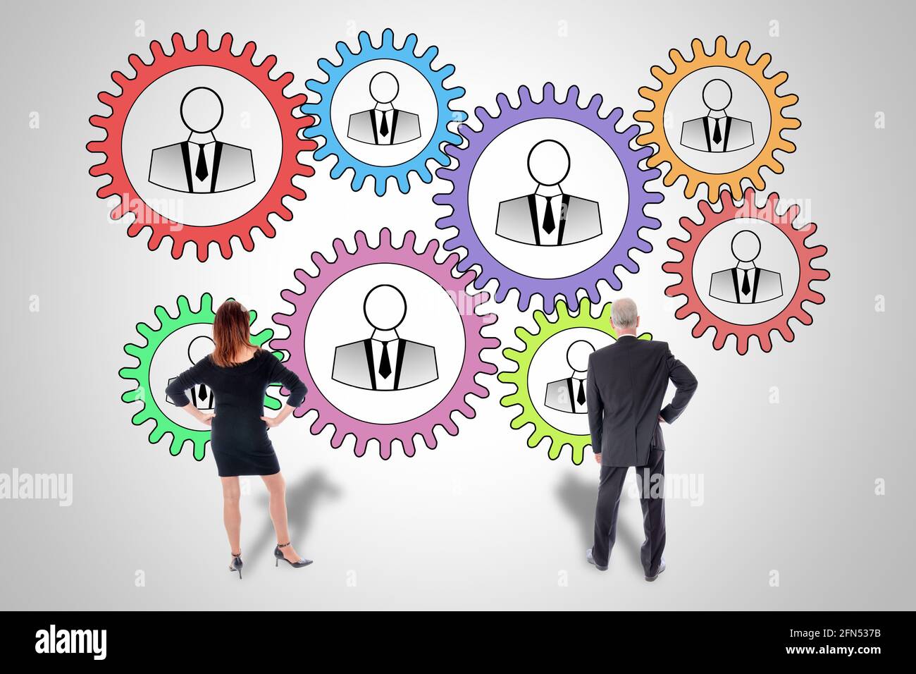 Teamwork concept drawn on a wall watched by business people Stock Photo ...