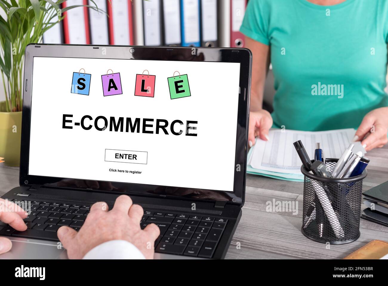 Laptop screen with e-commerce concept Stock Photo - Alamy