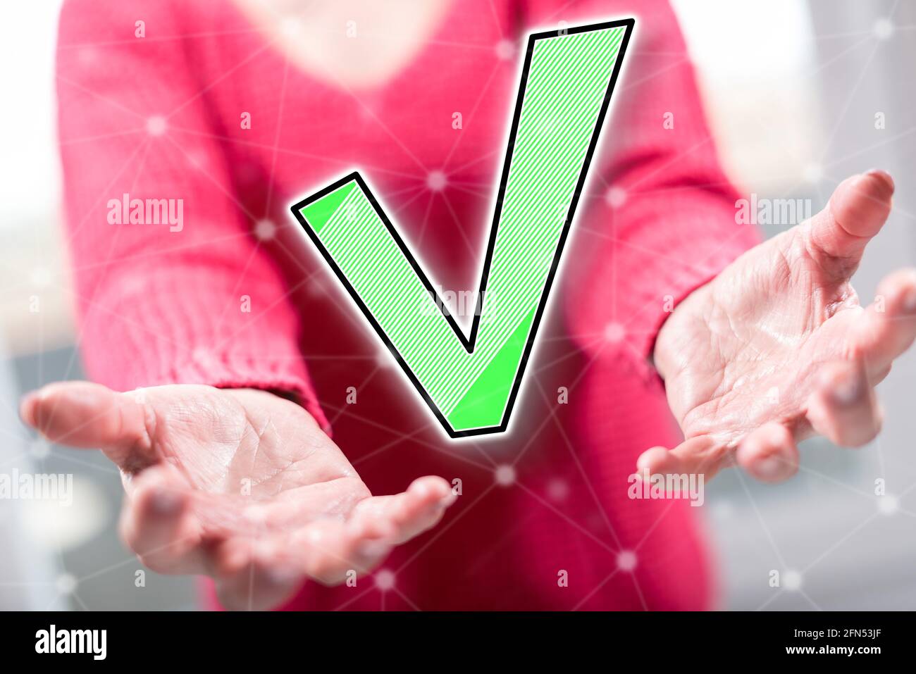Validation concept above the hands of a woman in background Stock Photo ...