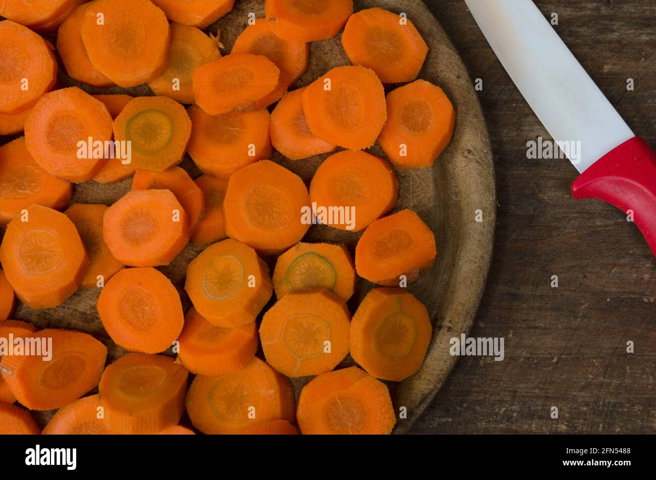 plate with cut carrots seen from above. ingredient for salad or healthy ...