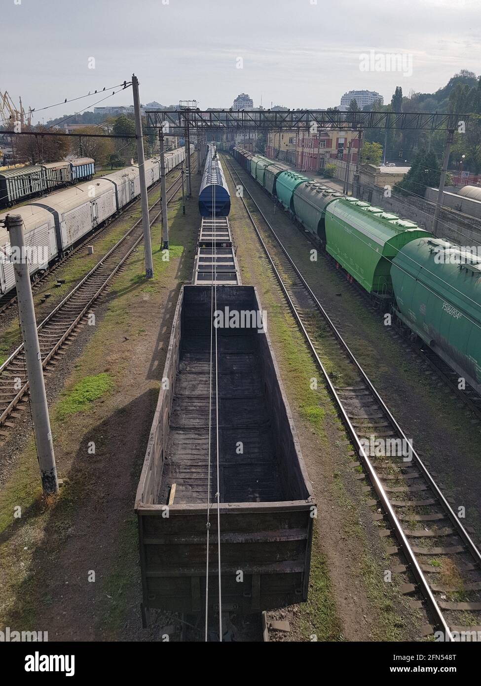 Freight cars on rails in the seaport. Cargo transportation. Rail ...