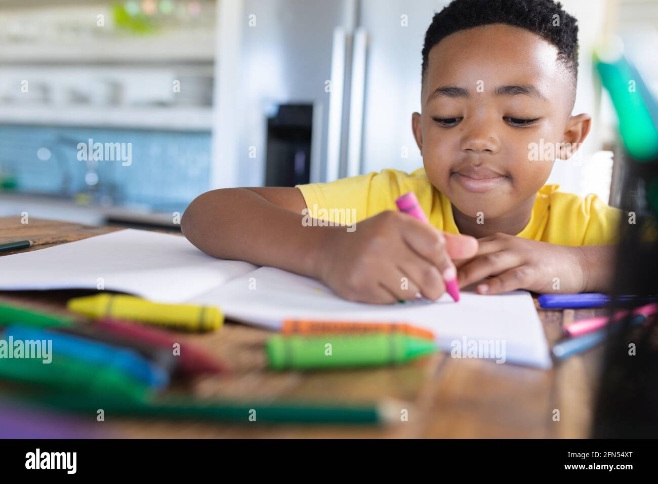 African boy writing hi-res stock photography and images - Alamy