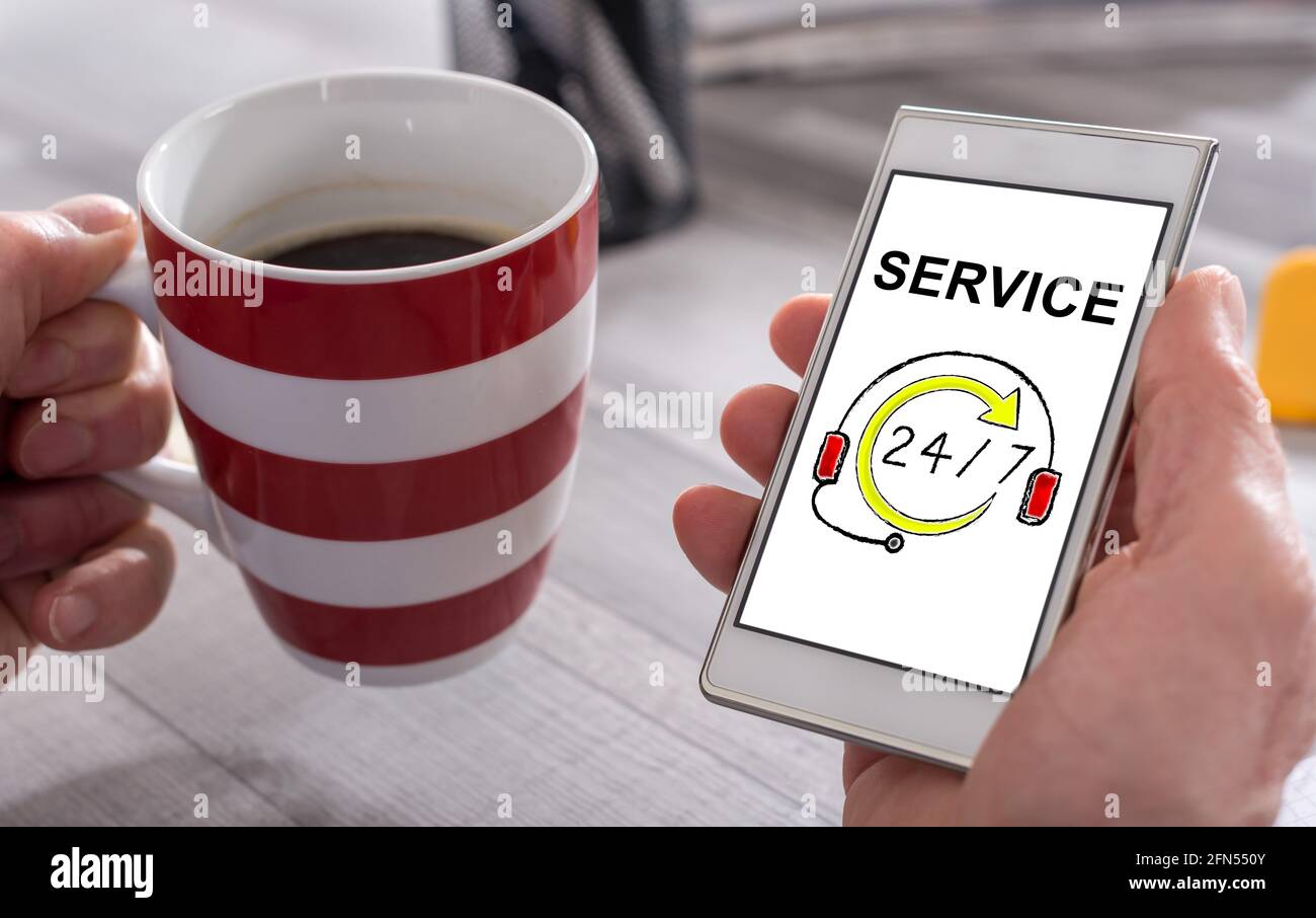 Male hand holding a smartphone with service concept Stock Photo - Alamy