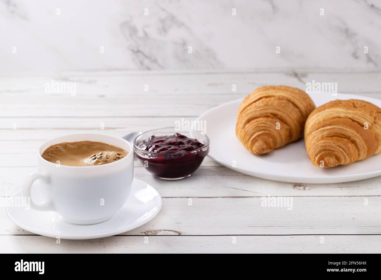 cup of coffee and croissants with jam Stock Photo - Alamy