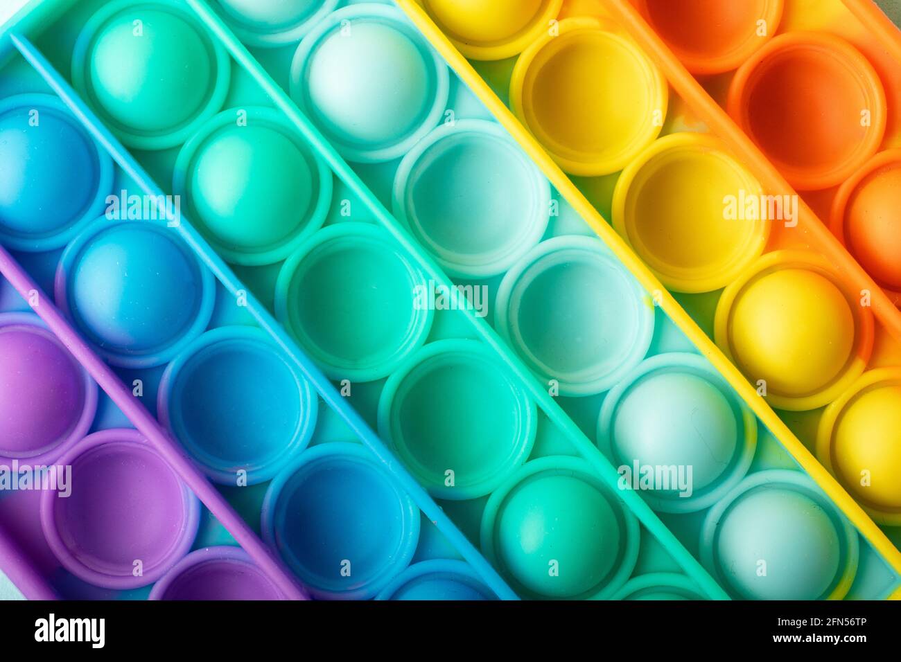 Top view of the new sensory toy - pop it.Rainbow color,concave and ...