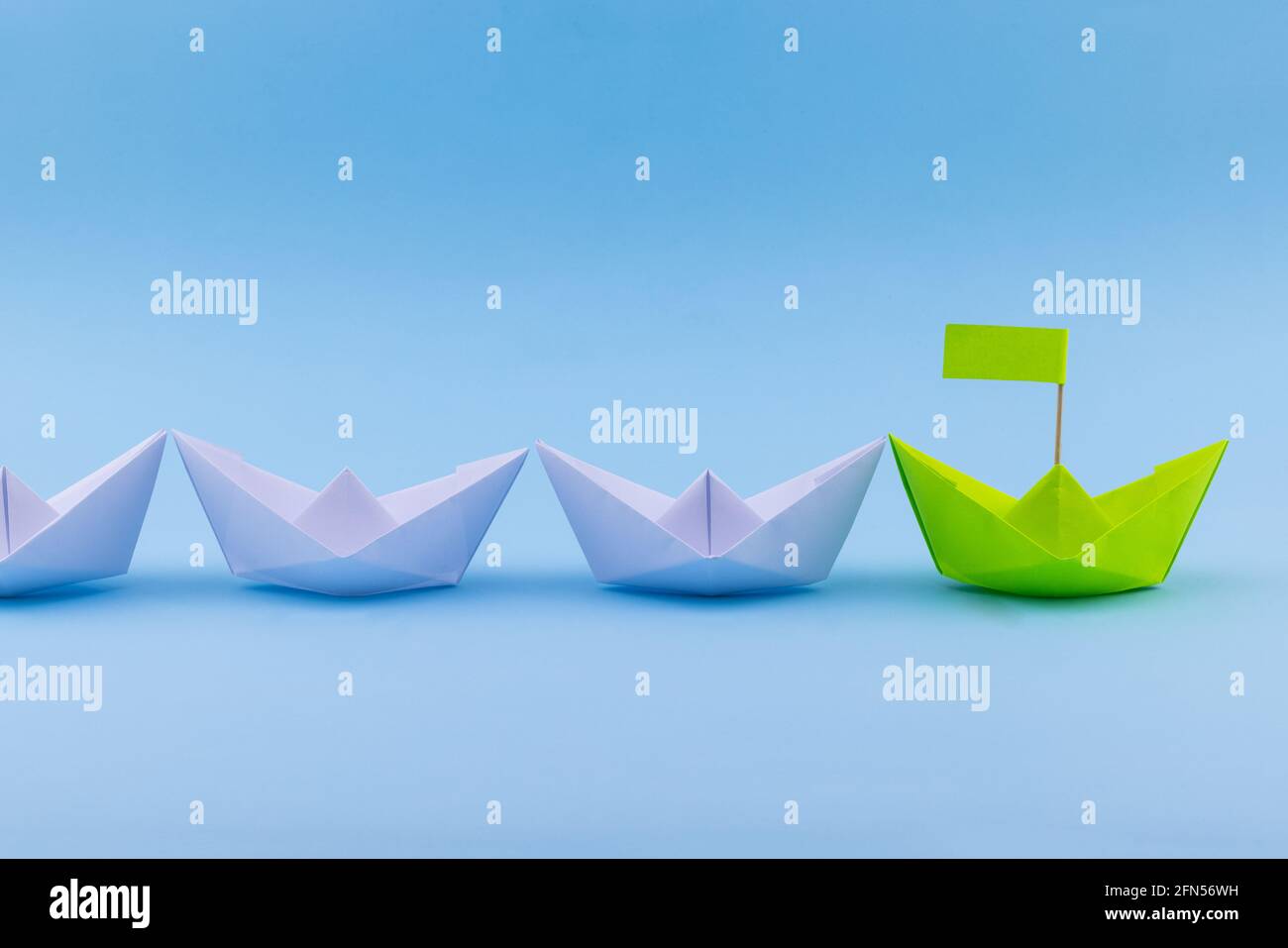 Red Paper Boat Leading A Fleet Of Small White Boats - Leader ship ...