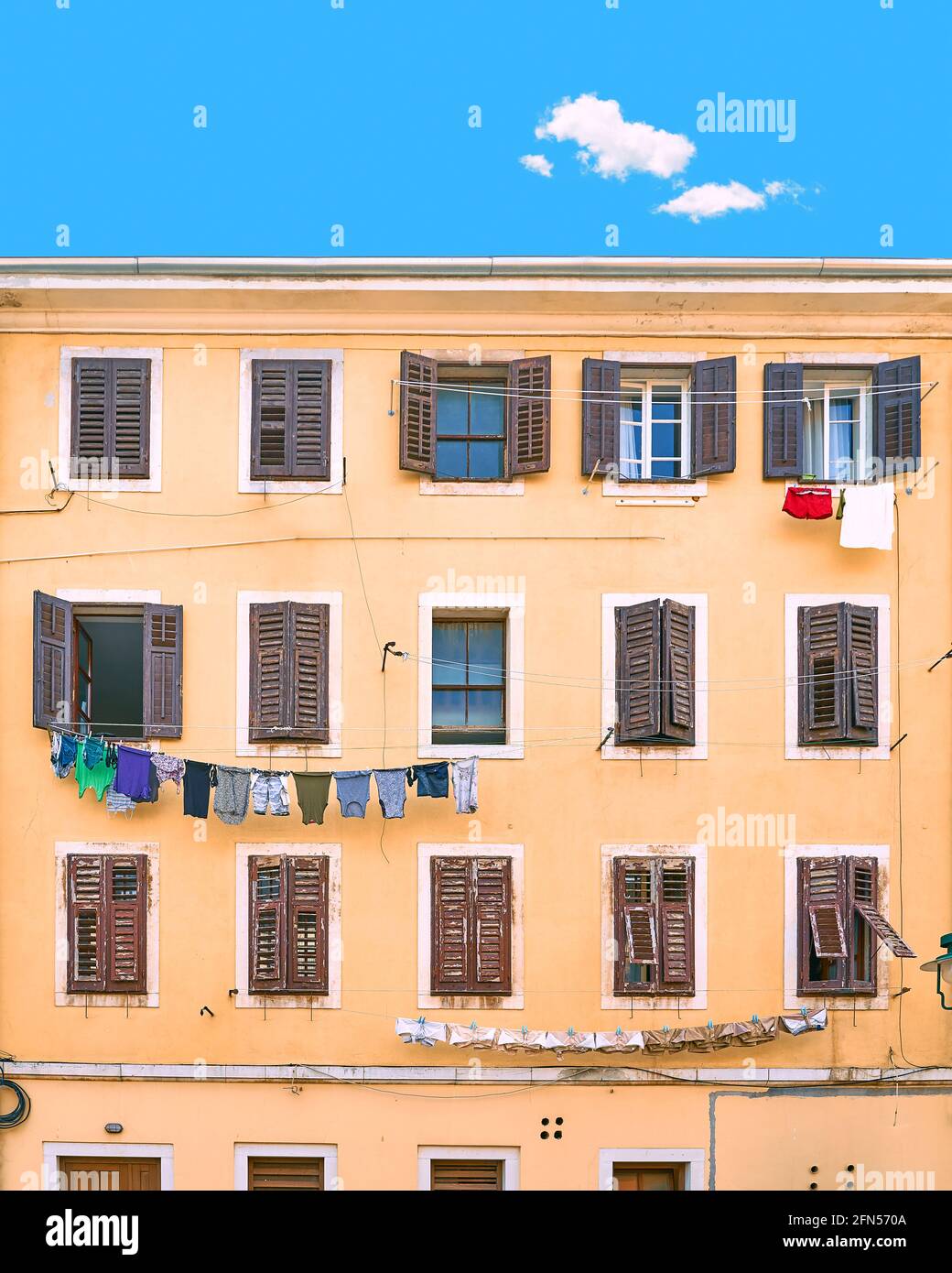 Picturesque typical Italian slum residential house under a blue summer ...