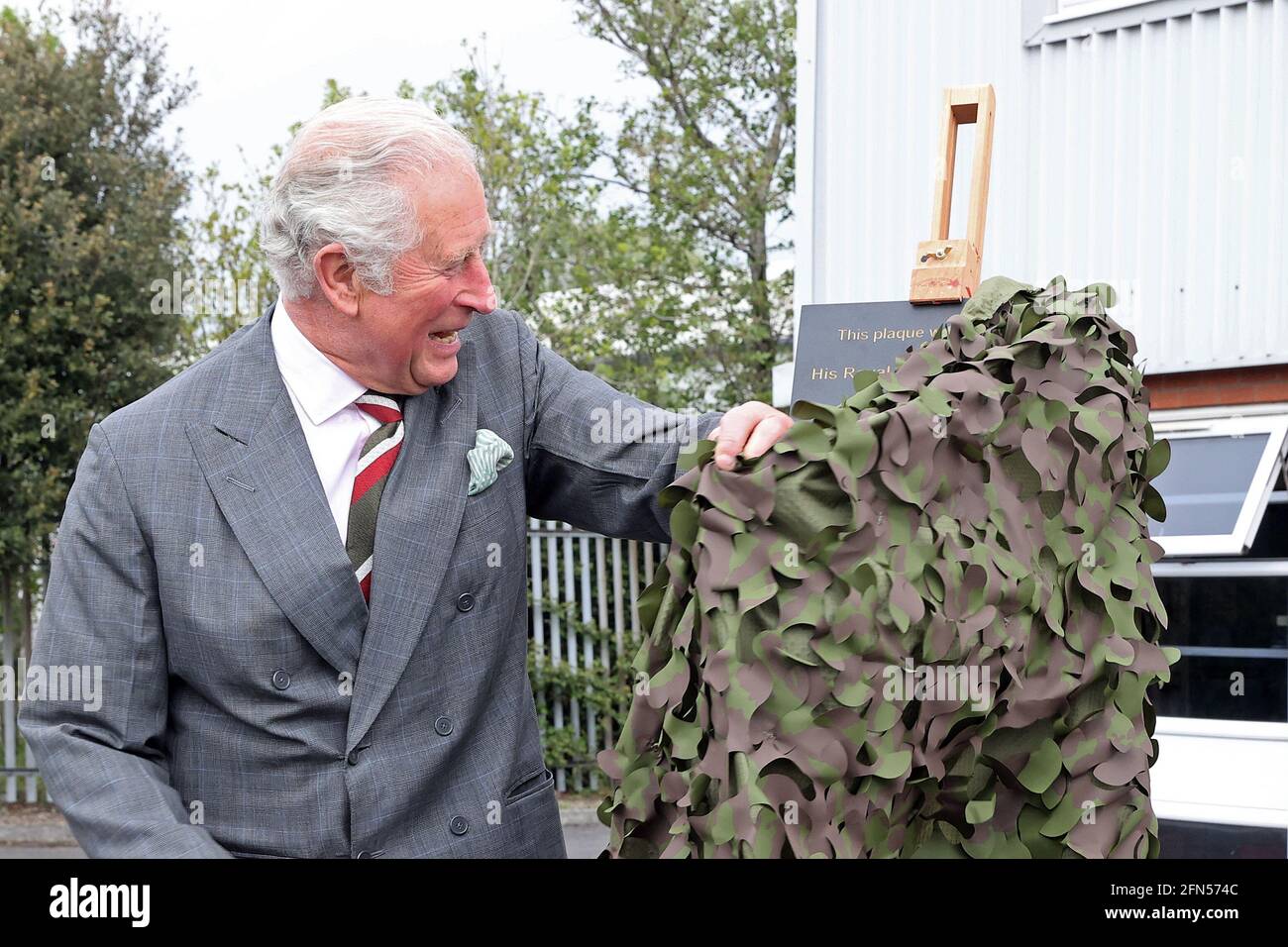 The Prince of Wales unveils a plaque to officially open the new ...