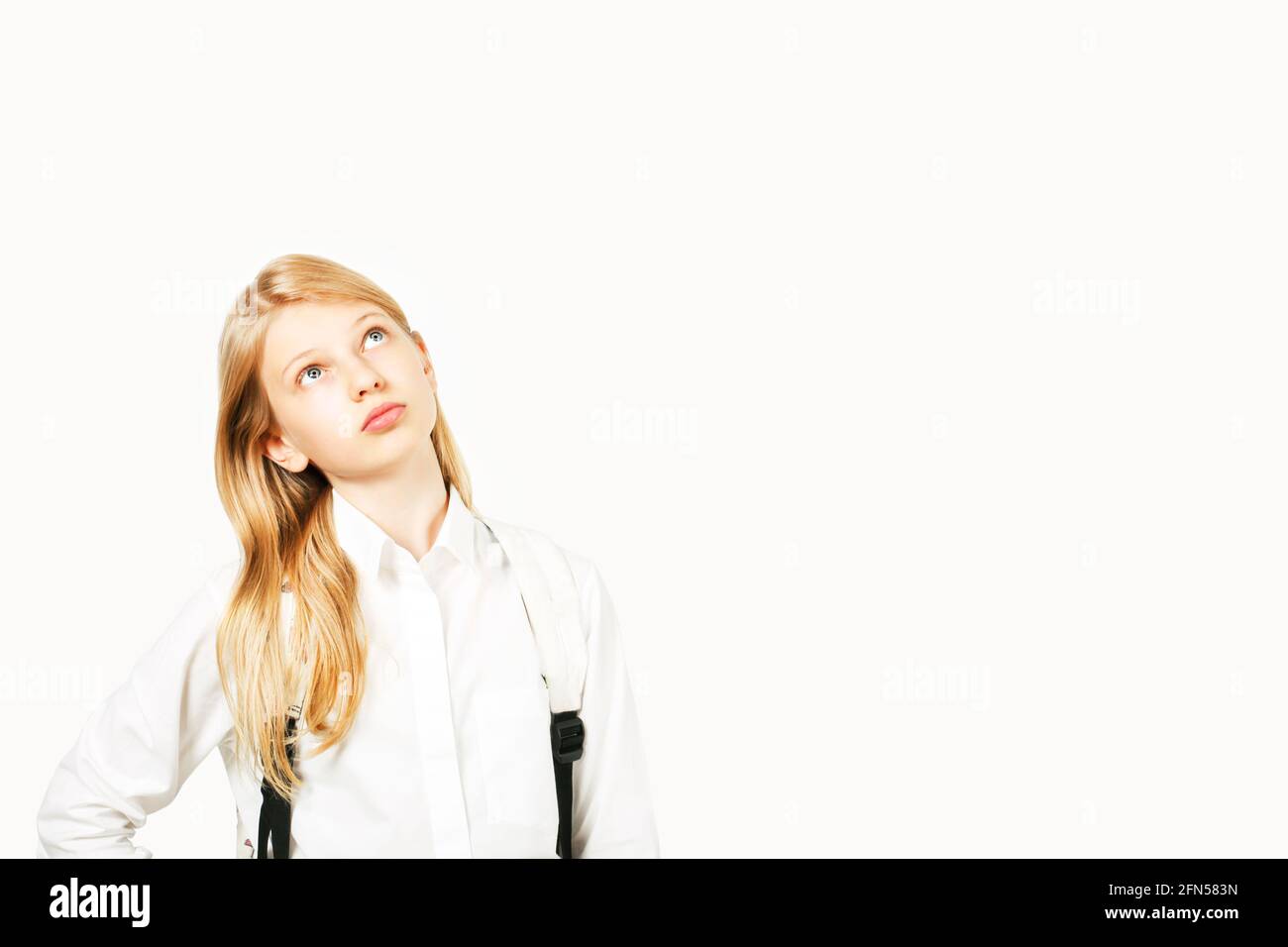 Close up portrait of young beautiful happy teenage school girl with ...