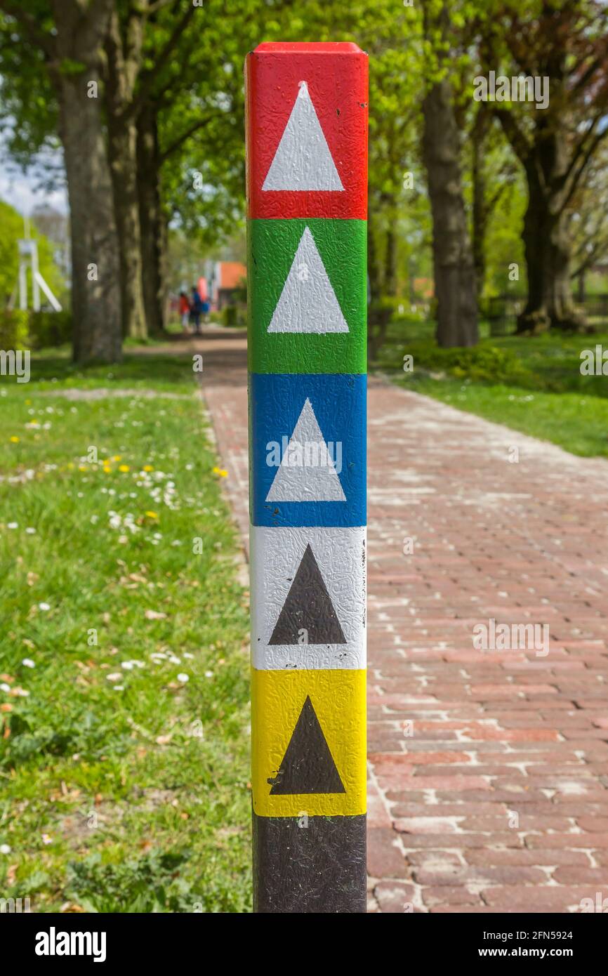 Colorful sign poiting to walking routes in Veenhuizen, Netherlands ...