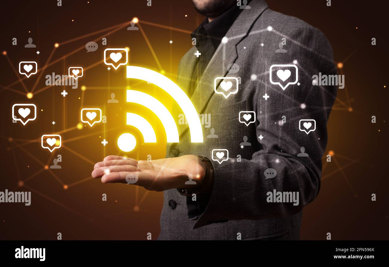 Hand holding social media icons Stock Photo - Alamy