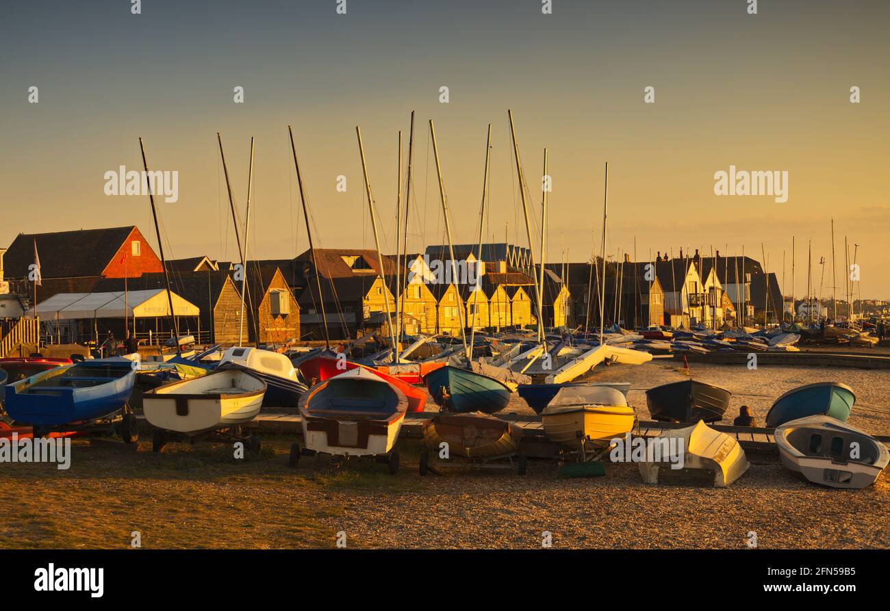 Boats on the beach at Whitstable Yacht Club at sunset - Whitstable ...