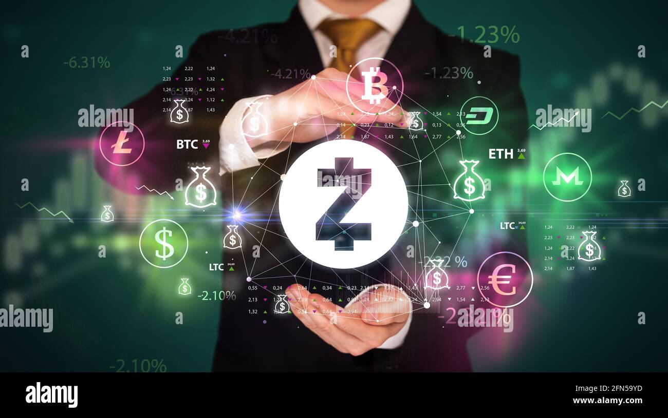 Businessman holding currency symbols concept Stock Photo - Alamy